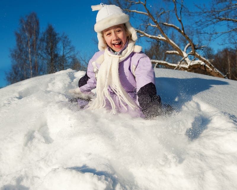 Little Girl Sliding in the Snow Stock Image - Image of little, snowy ...