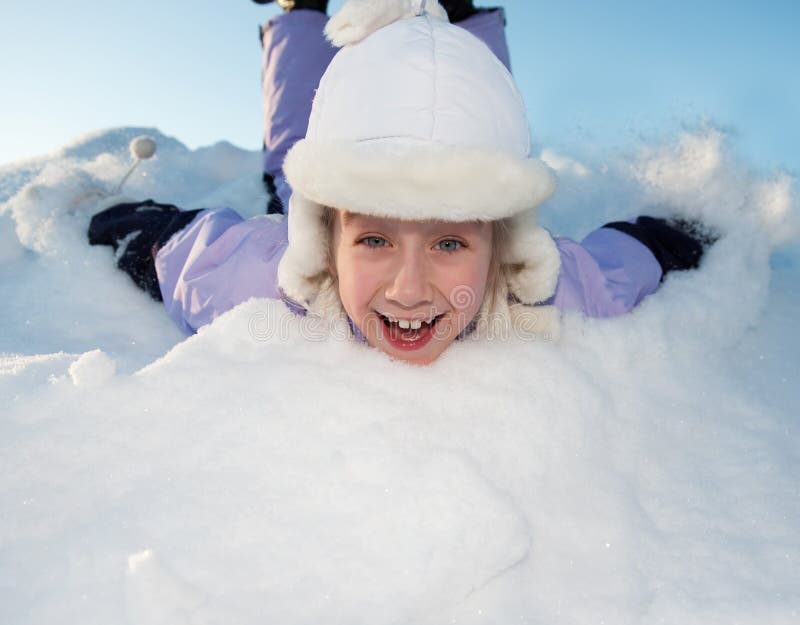 Little Girl Sliding in the Snow Stock Photo - Image of smile, snow ...