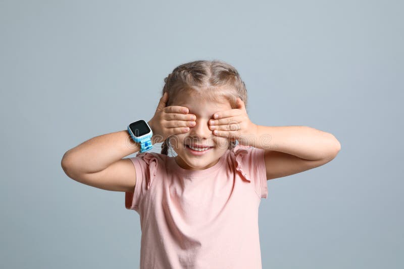 Little Girl with Smart Watch on Grey Background Stock Image - Image of ...