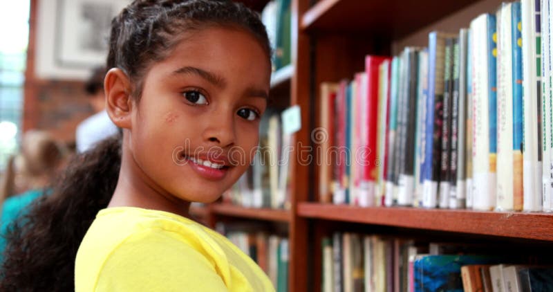 Little Girl Smiling at Camera in the Library Stock Video - Video of ...