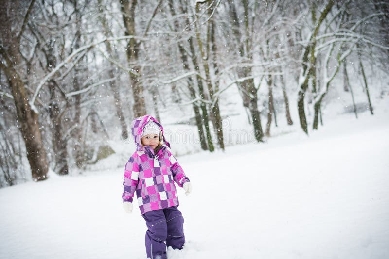 Little girl in snow stock photo. Image of playful, people - 46606452