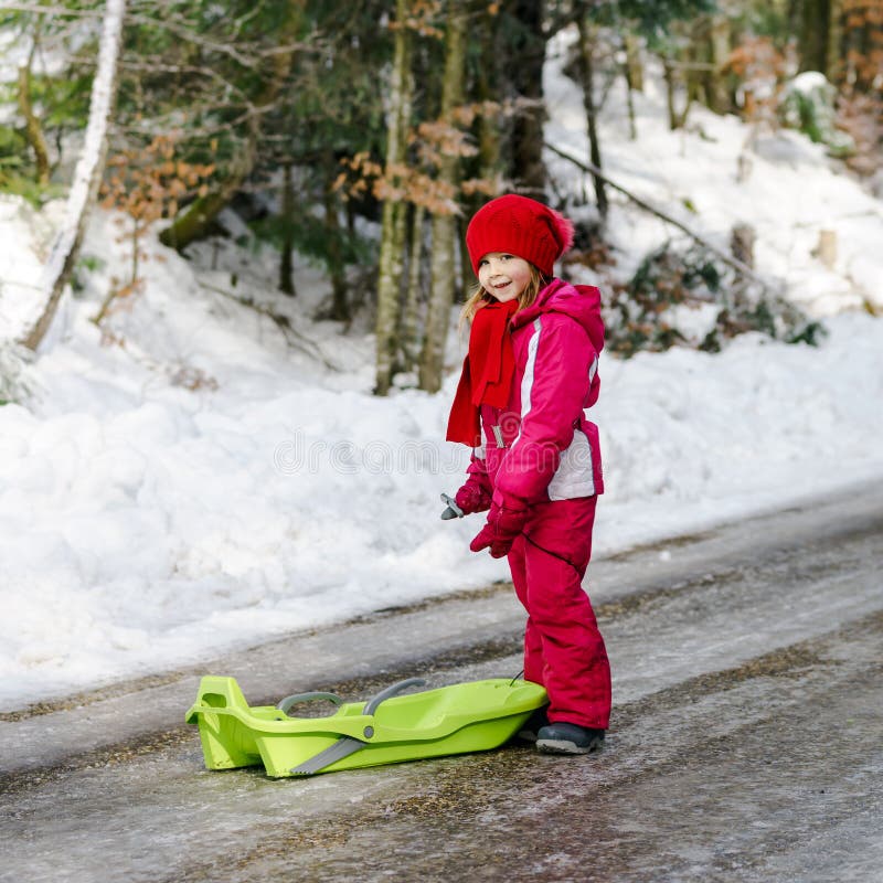 Little Girl with Snow Sleds Stock Image - Image of season, happy: 67106901