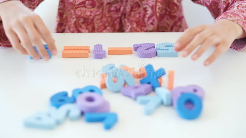 Little Girl Solving Math Task Using Numbers Stock Video - Video of ...