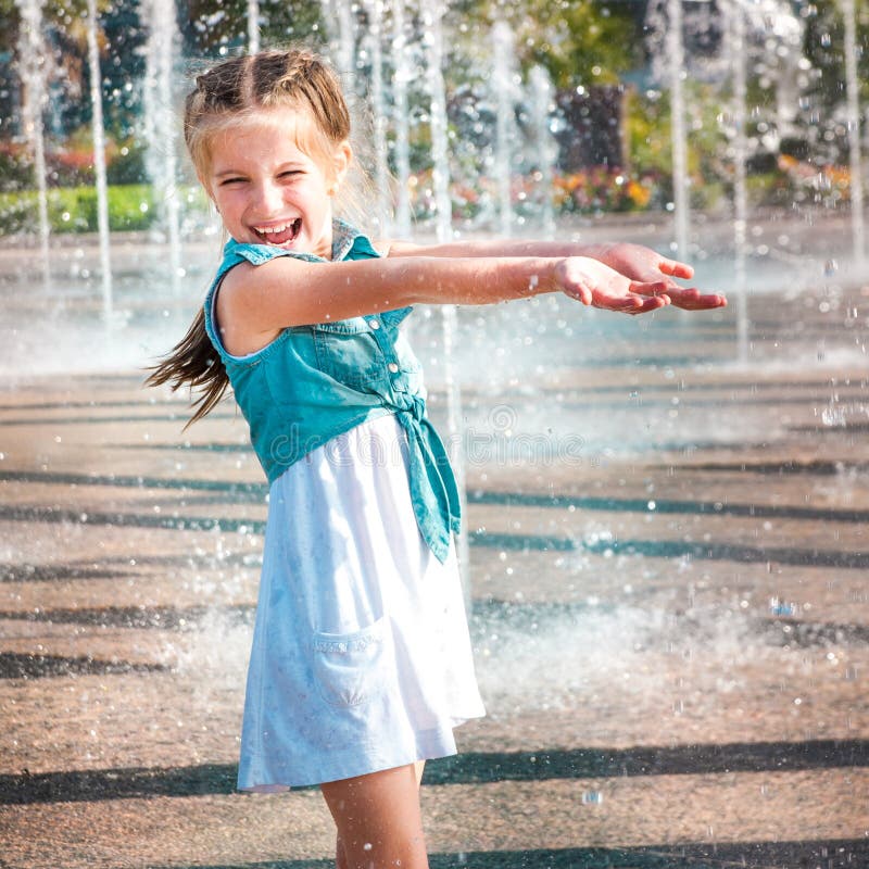 Little Girl in Splashes a Fountain Stock Photo - Image of jumping ...
