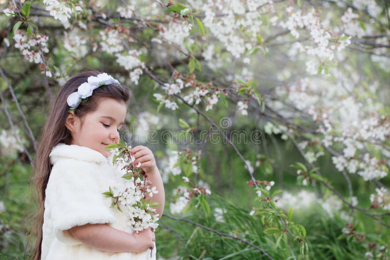 Little Girl in Spring Garden Stock Photo - Image of flowers, adorable ...
