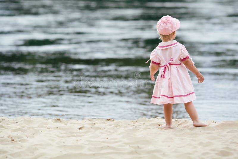 Little Girl Standing on the Coast of River Stock Image - Image of beach ...
