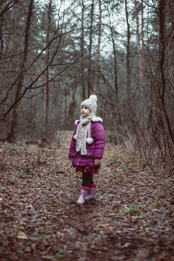 A Little Girl is Standing in a Forest on a Path. Stock Photo - Image of ...