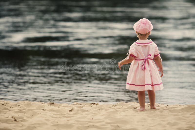 Little Girl Standing with Her Back on the Beach Stock Photo - Image of ...