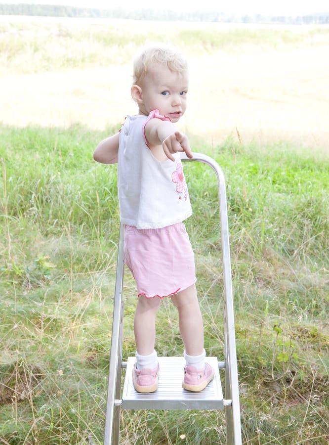 Little Girl Standing on Ladder Stock Photo - Image of outside, stading ...