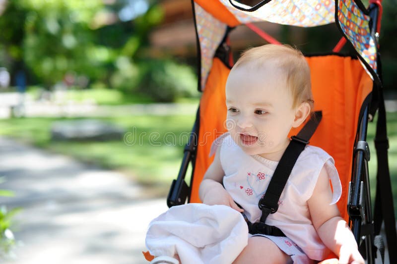 Little girl in a stroller stock photo. Image of love - 13382656
