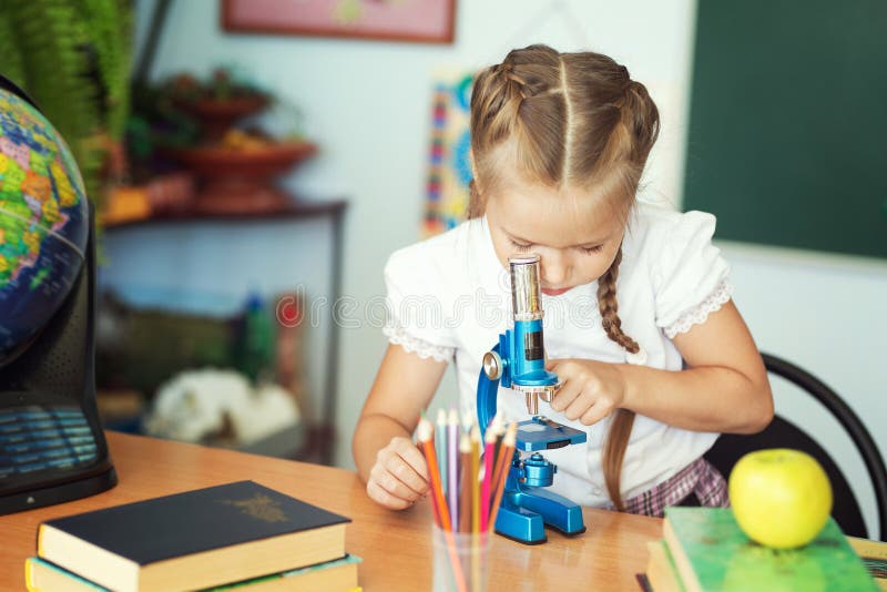 Little Girl Study with Microscope in Classroom Stock Photo - Image of ...