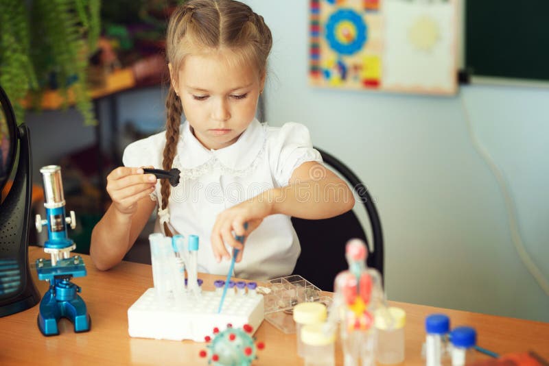 Little Girl Study with Microscope Doing Chemical Experiments in ...