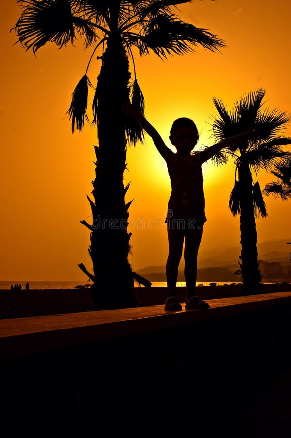 Little girl at sunset stock photo. Image of pleasure - 27400298