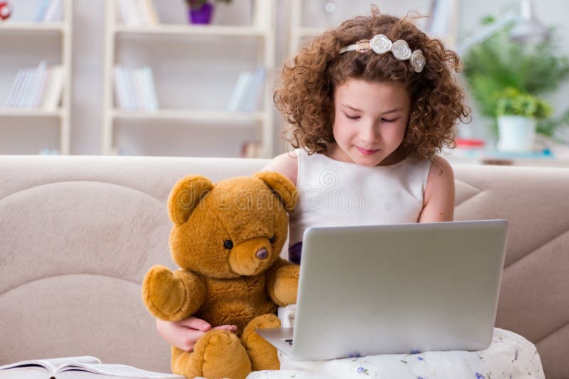 The Little Girl Surfing Internet on Laptop Stock Image - Image of ...