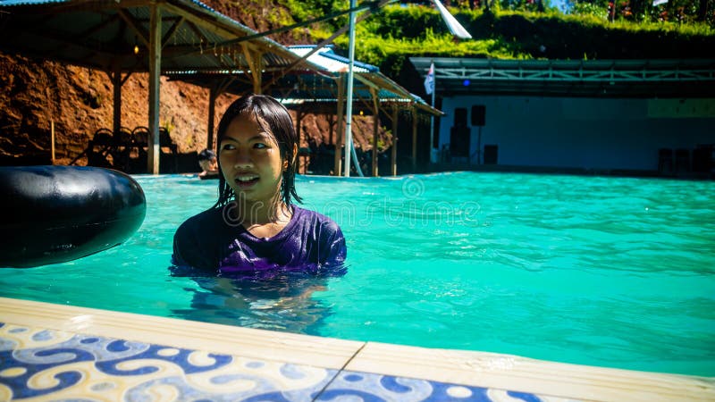 A Little Girl is Swimming in the Pool Stock Image - Image of portrait ...