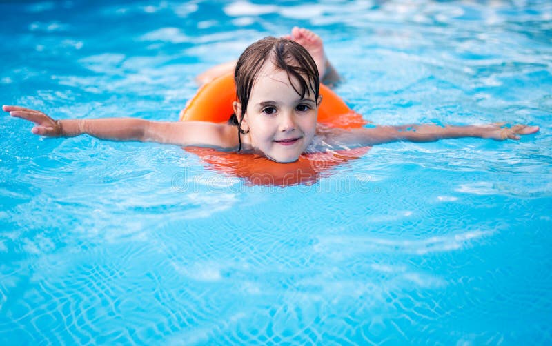 Little Girl in Swimming Pool with Float Ring Stock Image - Image of ...