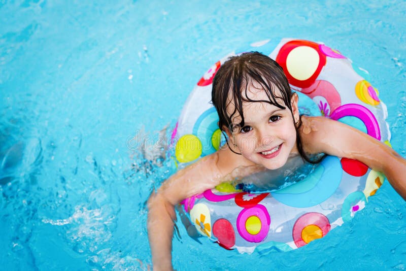 Little Girl in Swimming Pool with Float Ring Stock Photo - Image of ...
