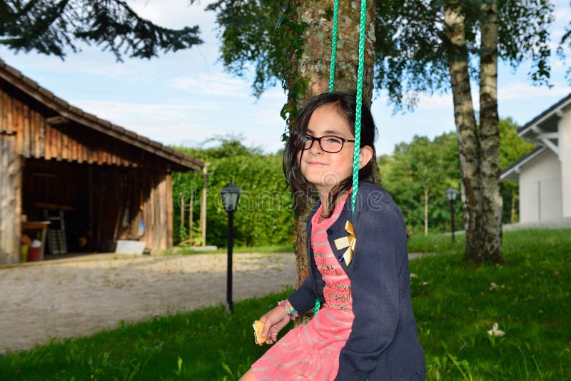 Little girl on swing stock photo. Image of happy, cute - 43327778