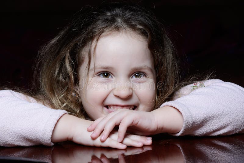 Little girl on table stock image. Image of sitting, faces - 36621973