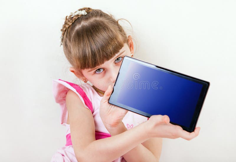 Little Girl with Tablet stock image. Image of female - 67219445