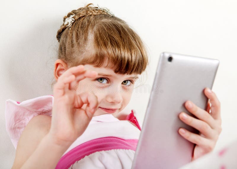 Little Girl with Tablet stock photo. Image of child, cheerful - 73188758