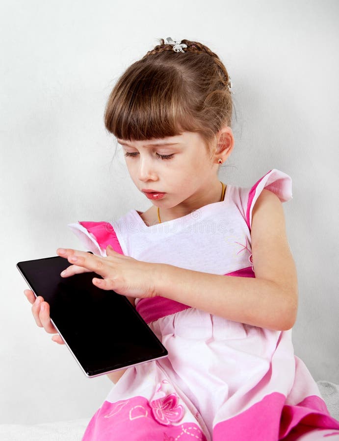 Little Girl with Tablet stock image. Image of leisure - 73188805