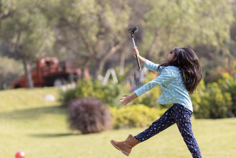 Little Girl Taking a Picture with an Action Camera Stock Image - Image ...