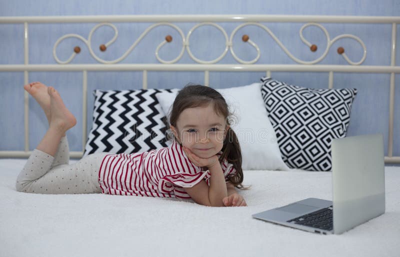 Little Girl Talking on a Laptop. Online Communication. Online Training ...