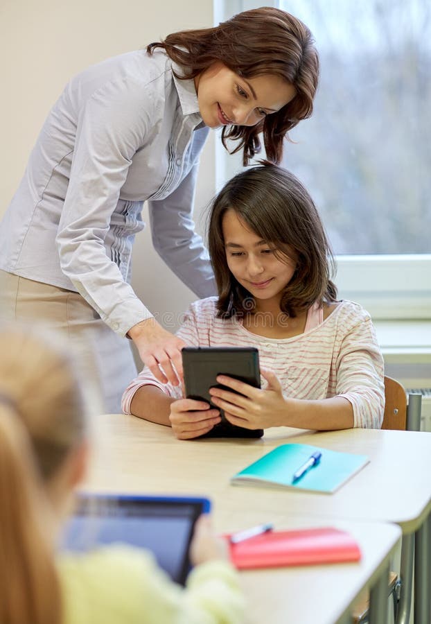 Little Girl with Teacher and Tablet Pc at School Stock Image - Image of ...