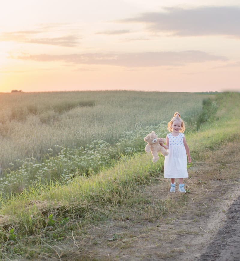 Girl with Teddy Bear on Road at Sunset Stock Image - Image of bear ...