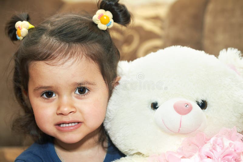 Little girl and teddy bear stock image. Image of girl - 64489285