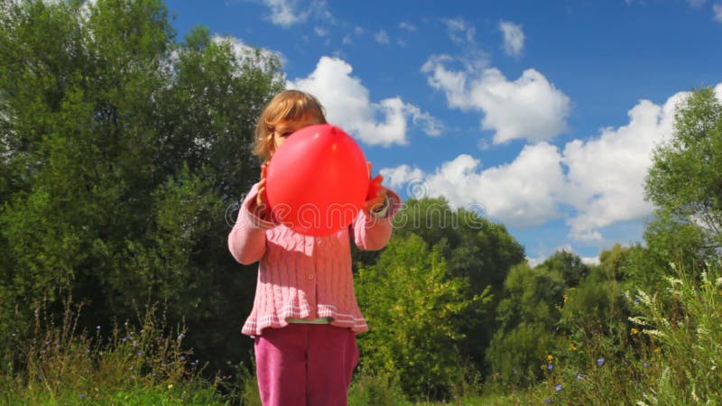 Little Girl Throwing Up Red Balloon in Stock Footage - Video of throw ...