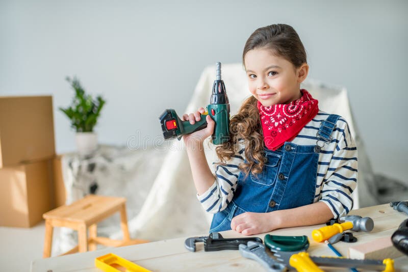 Little girl with tools stock image. Image of adorable - 90731233