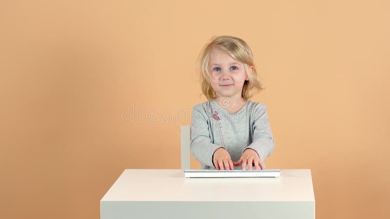 A Little Girl is Typing on the Keyboard, but it Doesn T Work Stock ... A Little Girl is Typing on the Keyboard, but it Doesn T Work Stock ...
