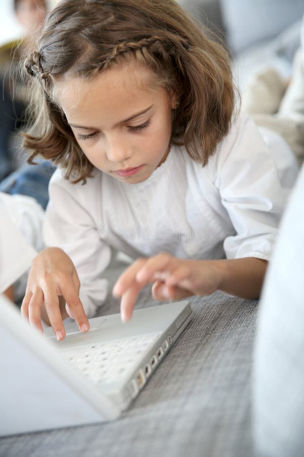 Little Girl Typing on Laptop Stock Photo - Image of typing ...