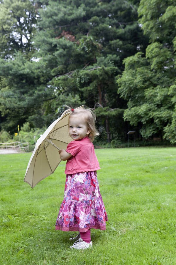 Little girl with umbrella stock photo. Image of cute - 14506710