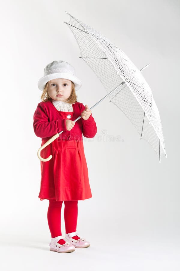 Little girl with umbrella stock photo. Image of high - 17654772