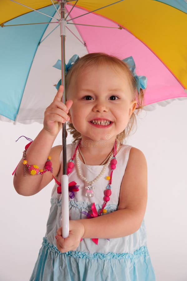 Little girl with umbrella stock image. Image of expressive - 19537755