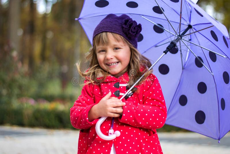 Little girl with umbrella stock photo. Image of purple - 61394856