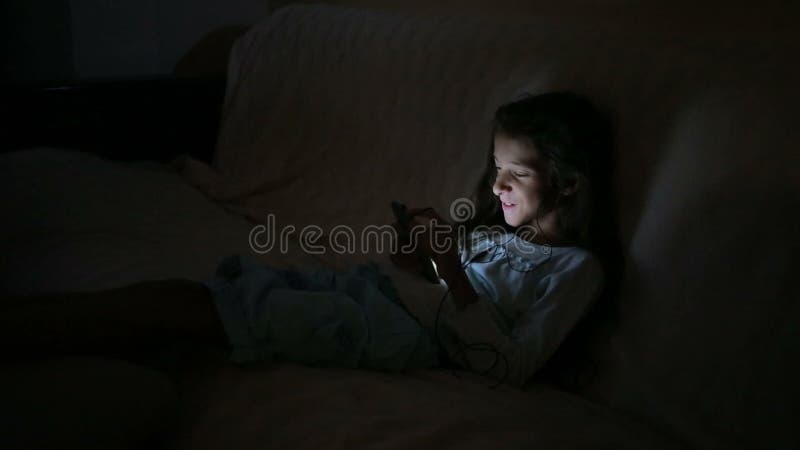 Little Girl Using a Cell Phone at Night Stock Footage - Video of ...