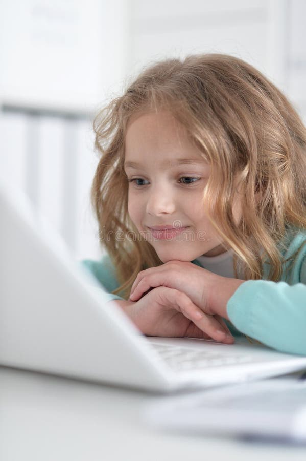 Little girl using computer stock image. Image of indoors - 72443527