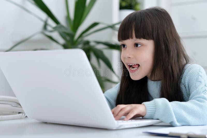 Little girl using computer stock image. Image of front - 73917335