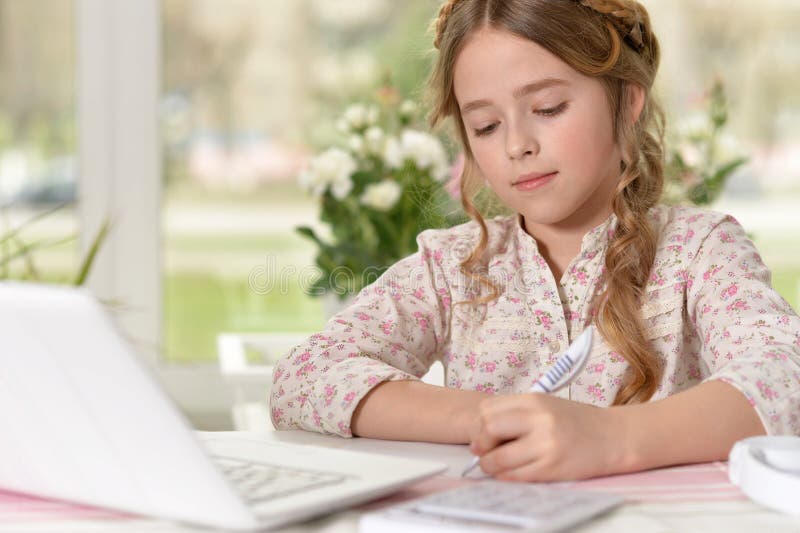 Little girl using computer stock image. Image of computer - 75793149