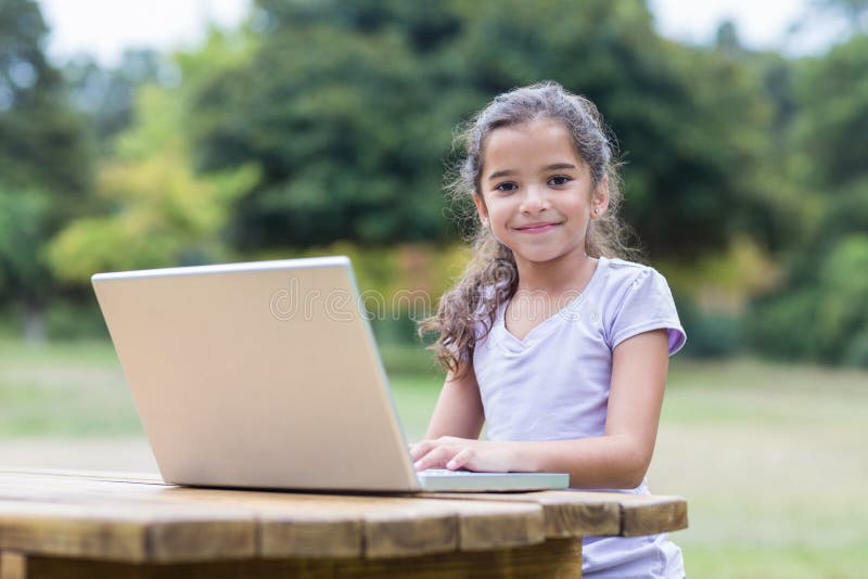 Little Girl Using Her Laptop Stock Image - Image of child, park: 53855253