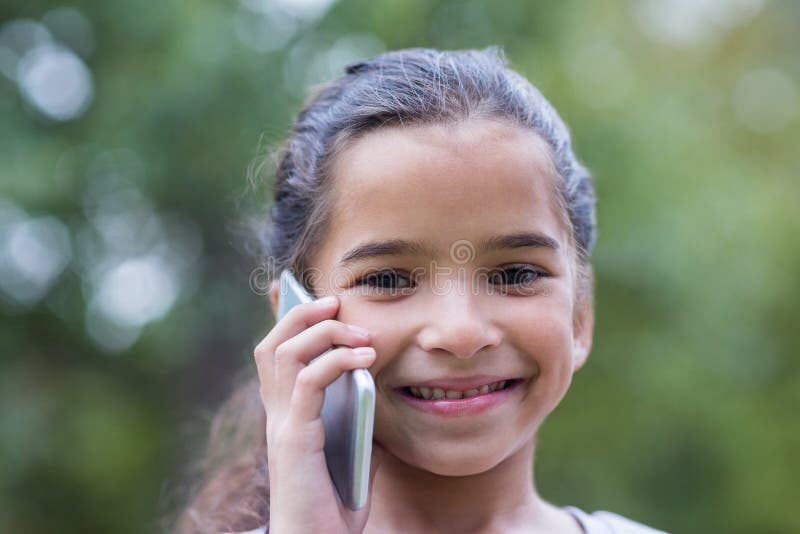Little Girl Using Her Phone Stock Photo - Image of phone, countryside ...