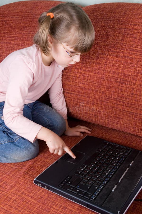 Little girl using laptop stock photo. Image of notebook - 18753668