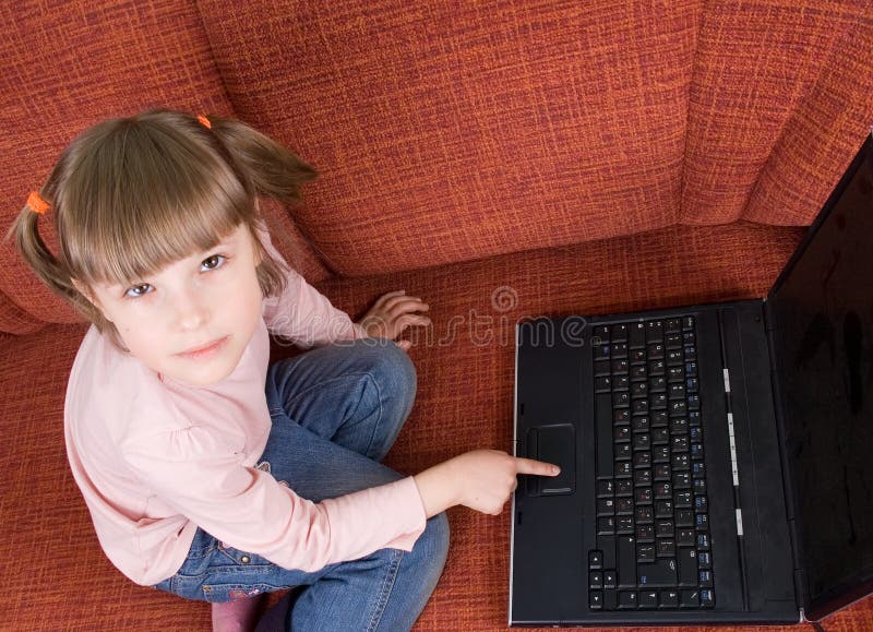 Little girl using laptop stock image. Image of computer - 18753761