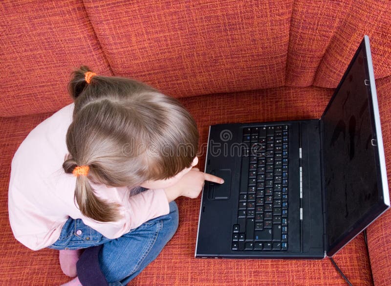 Little girl using laptop stock photo. Image of staring - 18754006