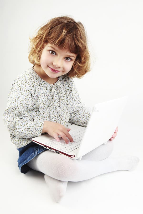 Little girl using laptop stock image. Image of intelligence - 31465811