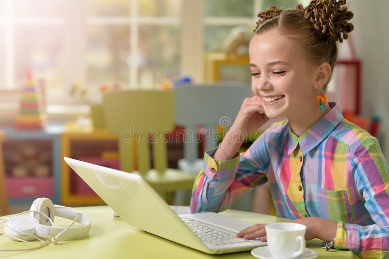 Little girl using laptop stock photo. Image of shape - 86181666